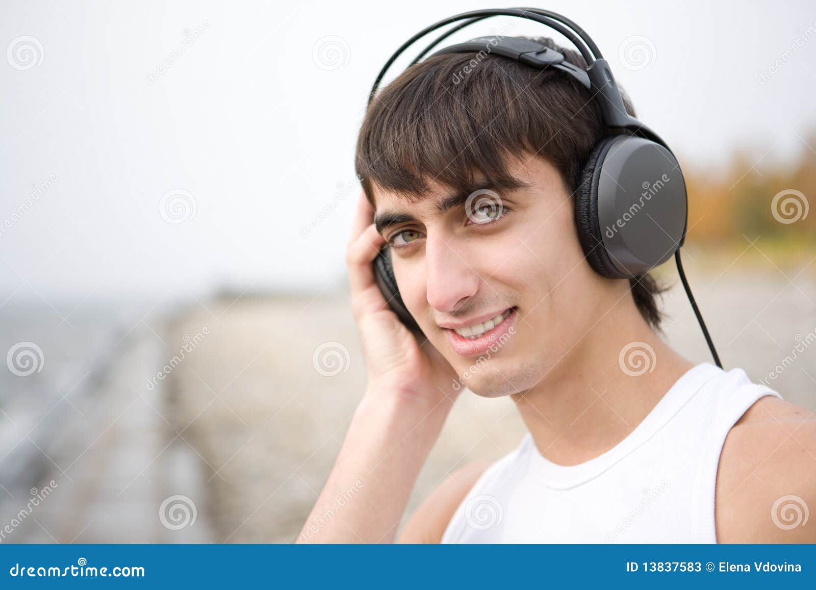 Young man listen to music stock image. Image of headphones - 13837583