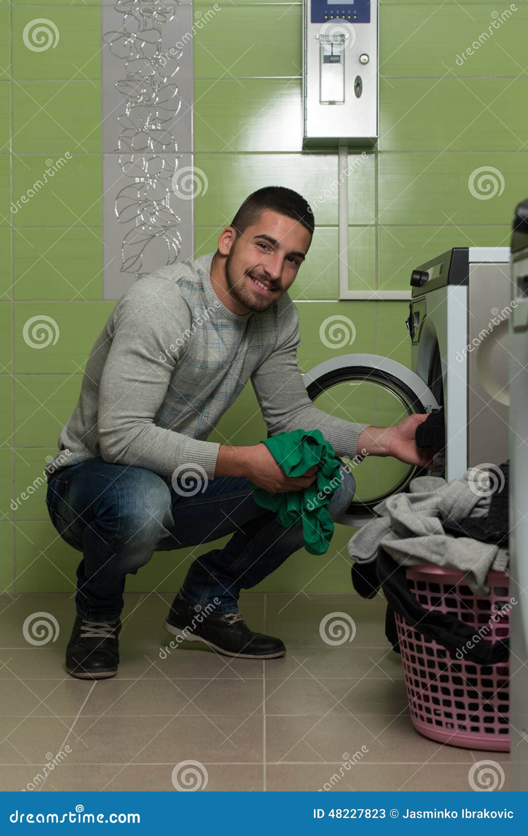 Young Man Loading the Washing Machine in Room Stock Image - Image of ...