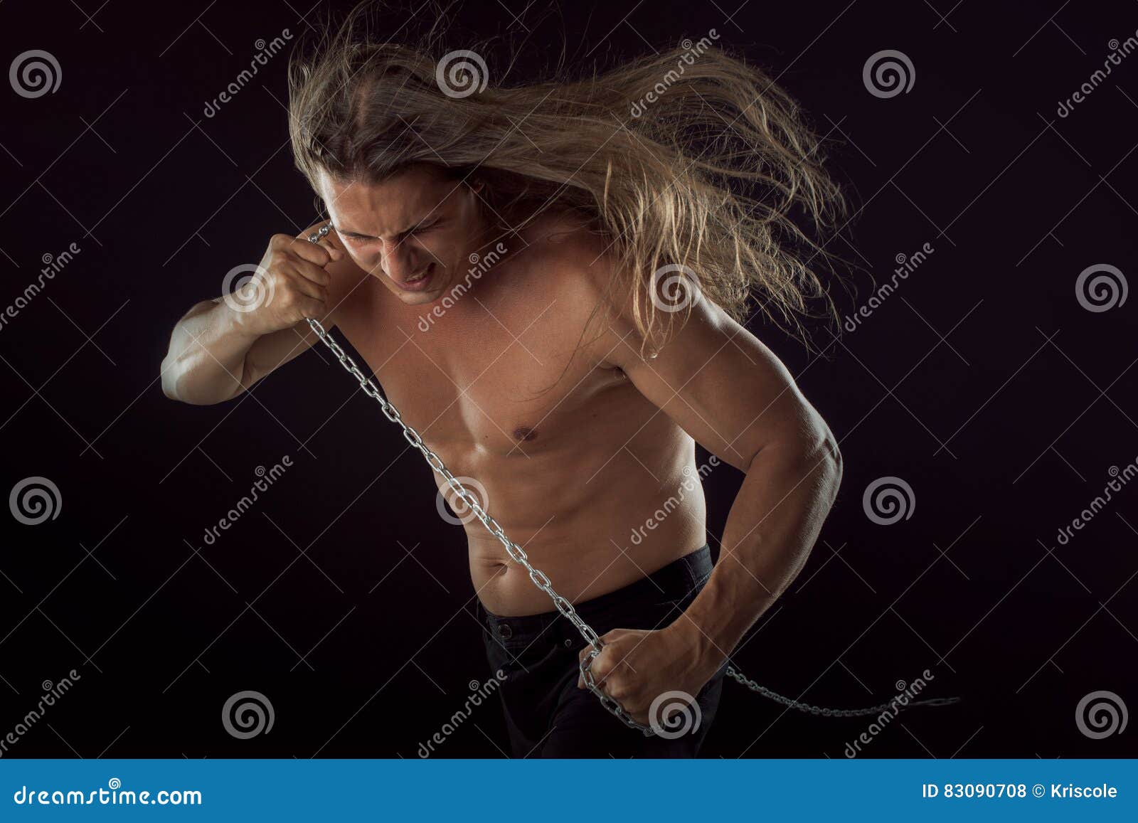 Young Man with Long Hair Dragging Something Behind Him. Strong. Stock ...