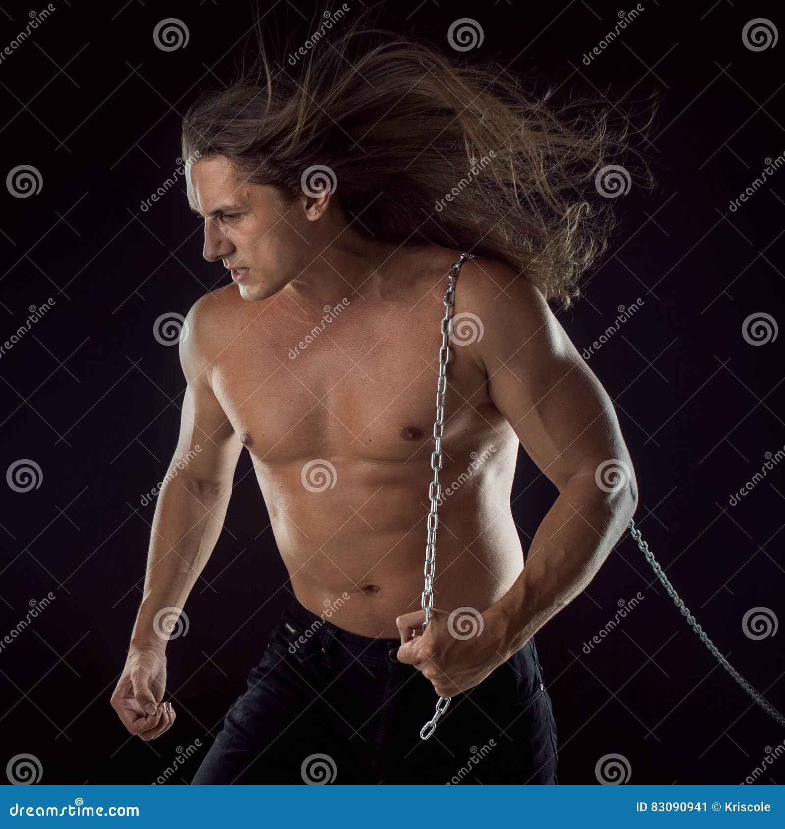 Young Man with Long Hair Dragging Something Behind Him. Strong. Stock ...