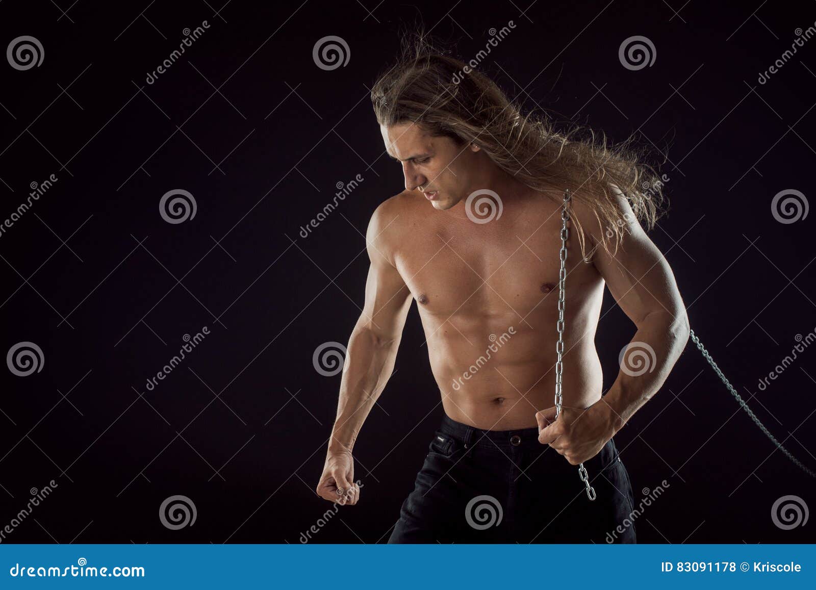 Young Man with Long Hair Dragging Something Behind Him. Strong. Stock ...