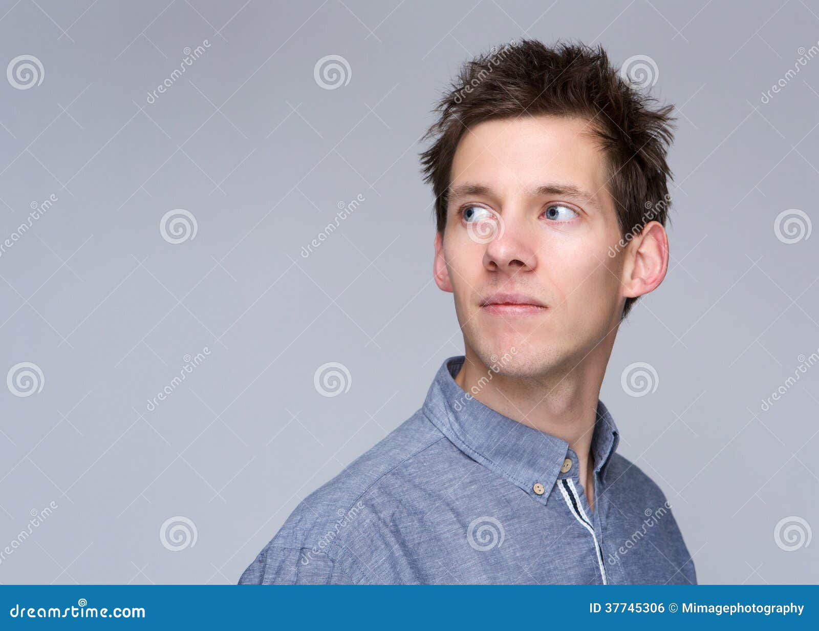 Young Man Looking Away on Gray Background Stock Photo - Image of male ...