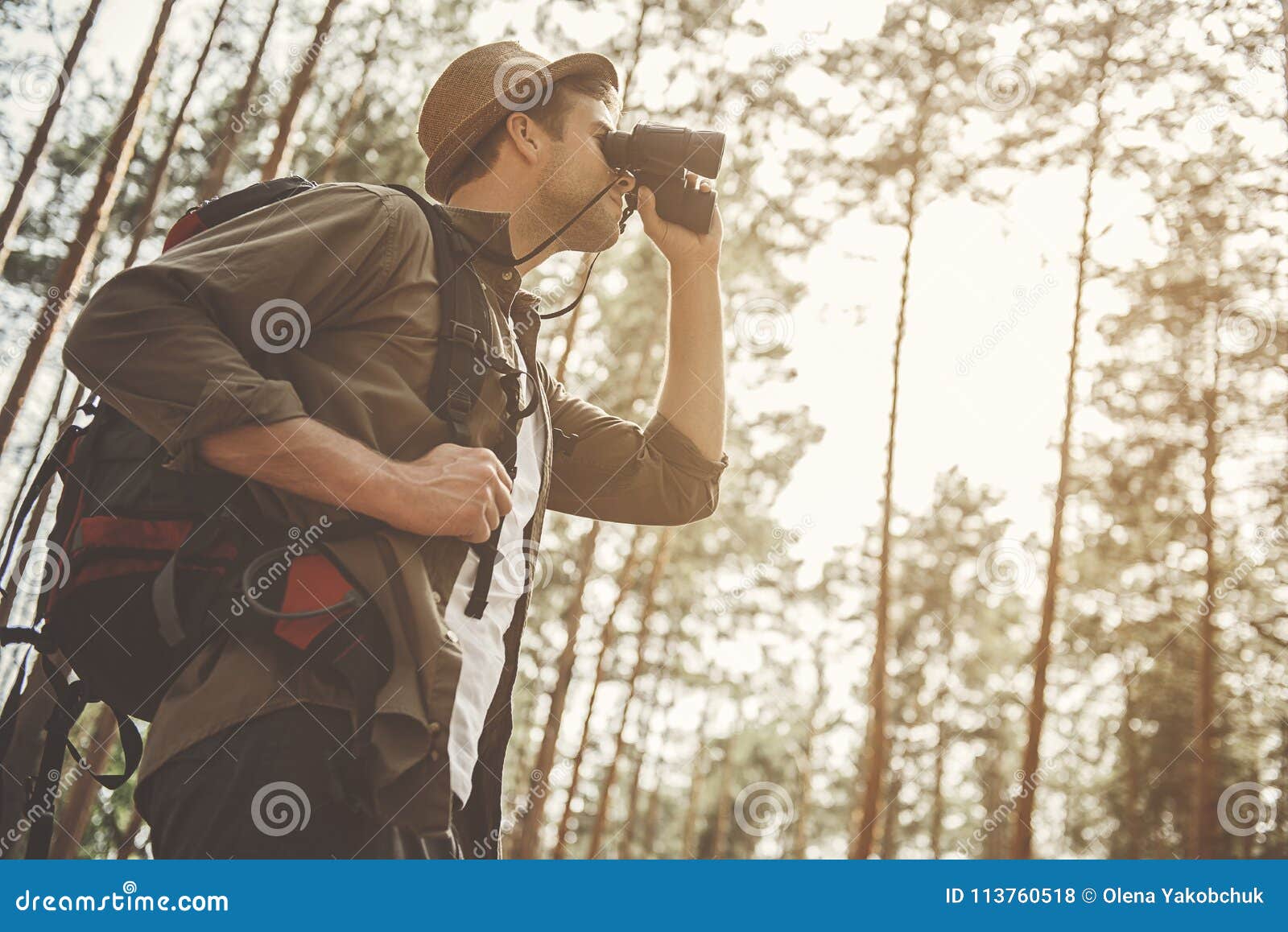Young Man is Looking through Binocular at Forest Stock Photo - Image of ...