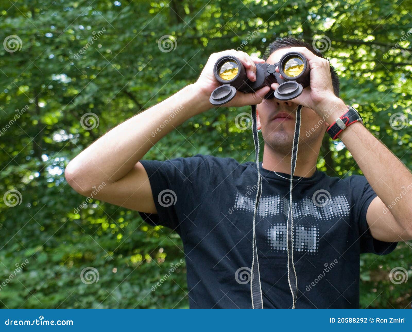 Young Man Looking through Binoculars Stock Photo - Image of looking ...