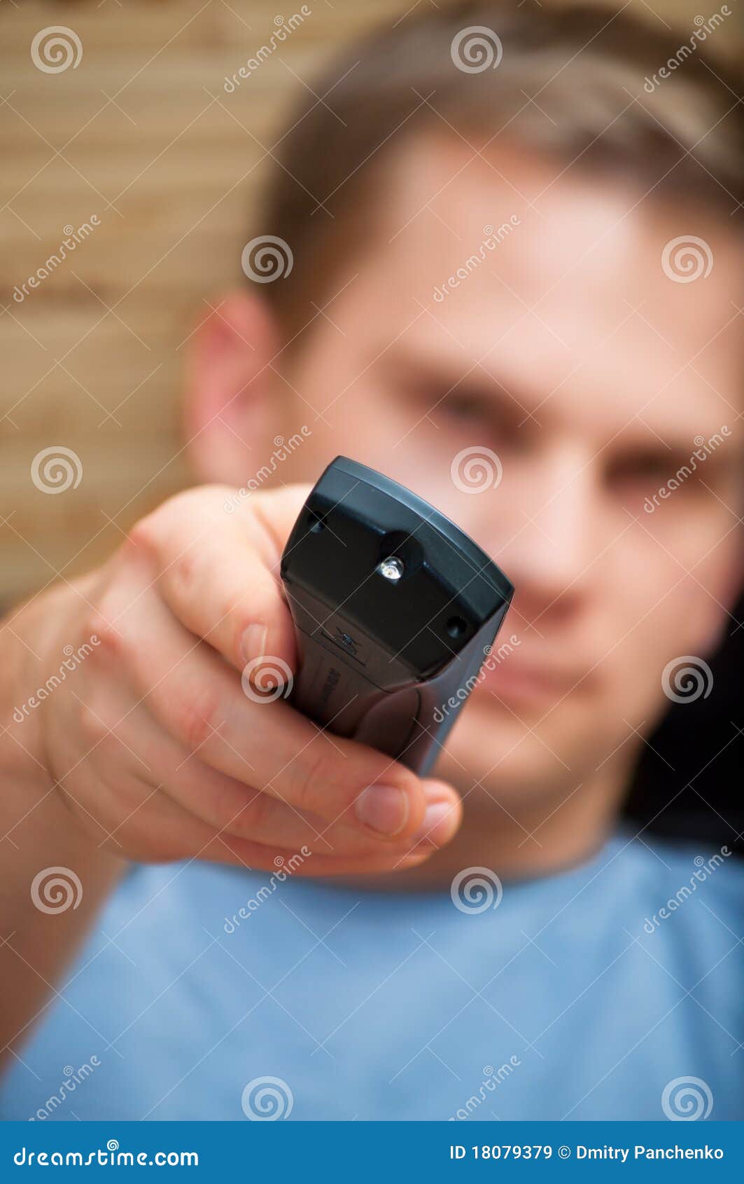 Young Man Looking at Camera with Remote Stock Image - Image of ...