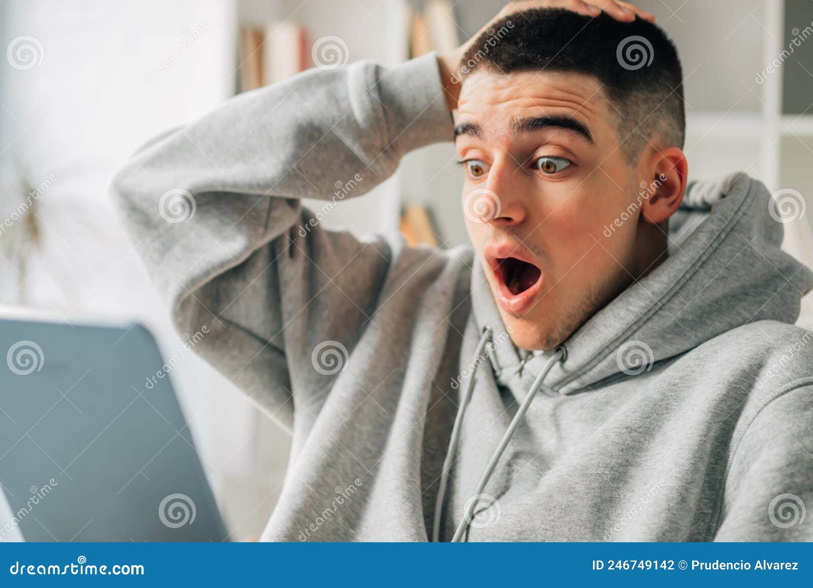 Young Man Looking at the Computer Stock Photo - Image of online, amazed ...