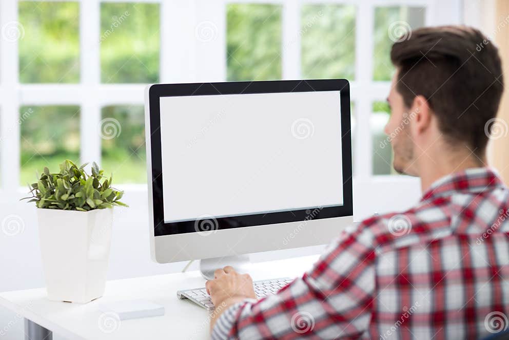 Young Man Looking at Computer Screen Stock Photo - Image of business ...