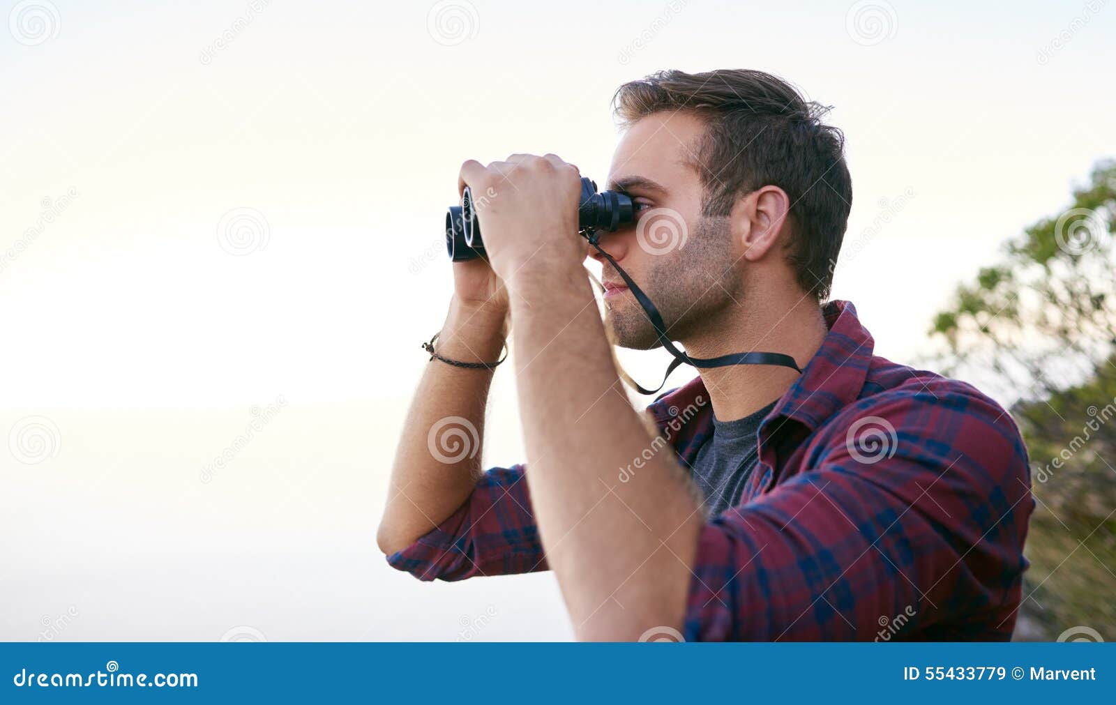 Young Man Looking into the Distance with Binoculars Stock Image - Image ...