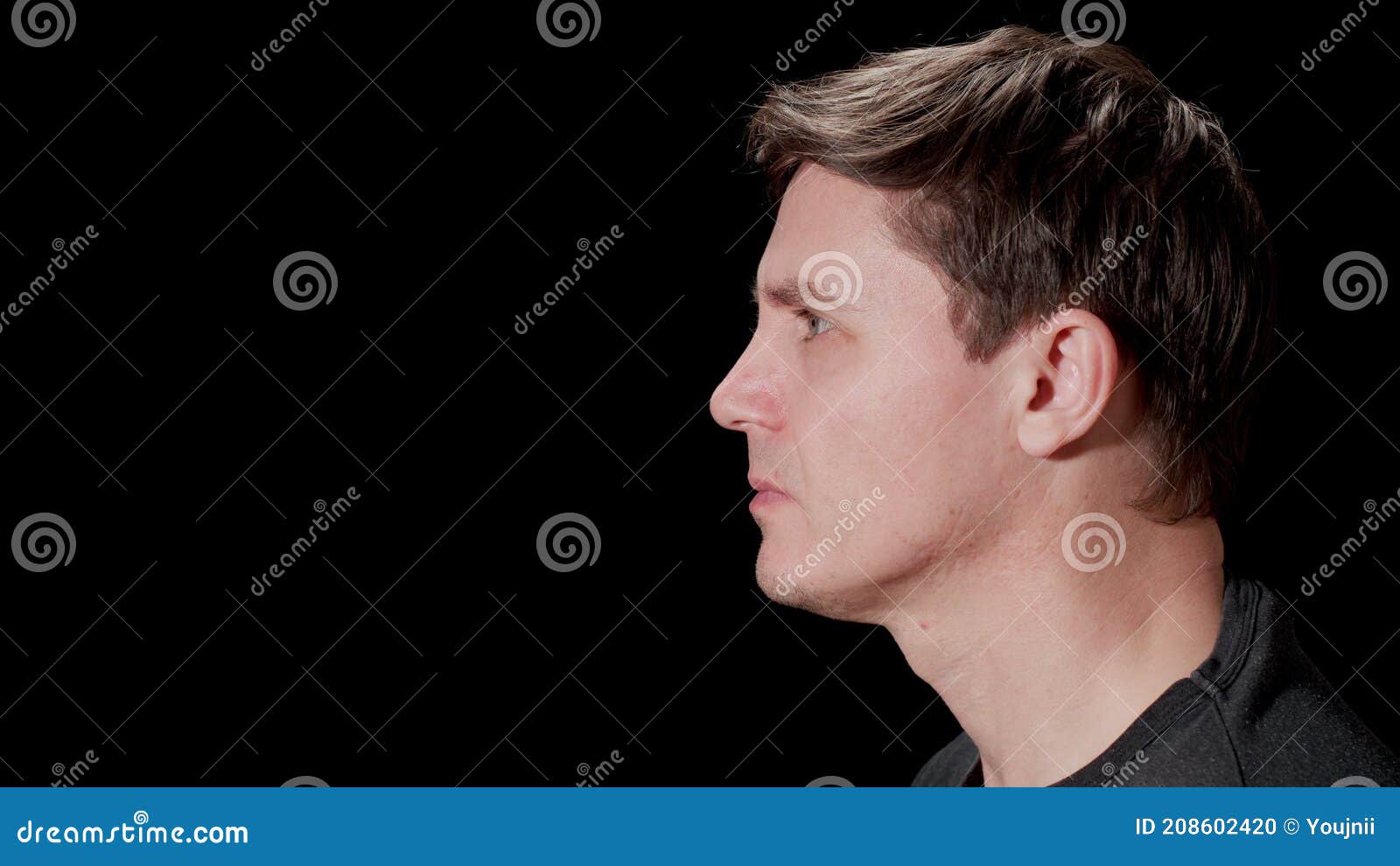 Young Man Looking Far Away. Side View. Stock Photo - Image of forehead ...