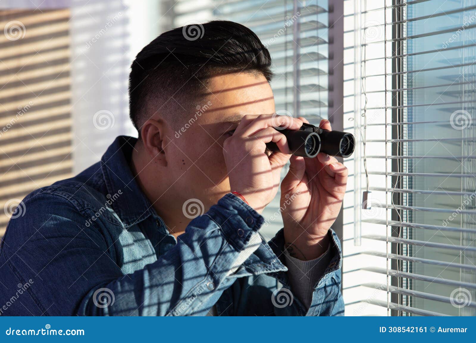 Young Man Looking through Glass Window with Binoculars Stock Image ...