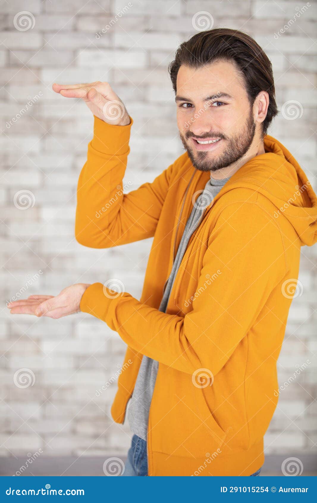 Young Man Looking at Hands Showing Something Huge Stock Photo - Image ...