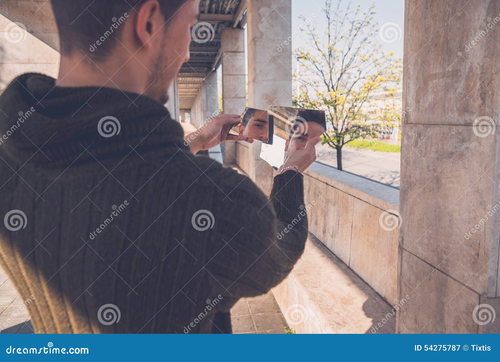 Young Man Looking at Himself in a Broken Mirror Stock Image - Image of ...