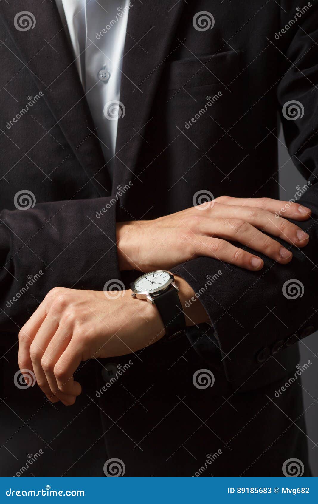 Young Man is Looking at His Watch Stock Image - Image of handsome ...