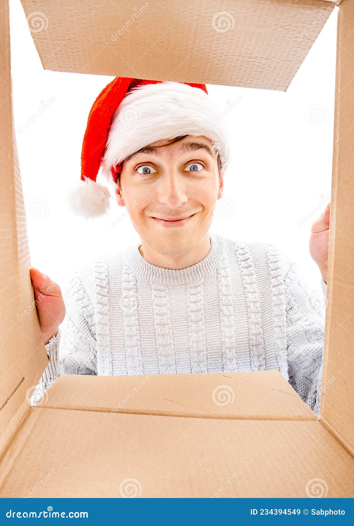 Young Man Looking Inside a Box Stock Image - Image of male, santa ...