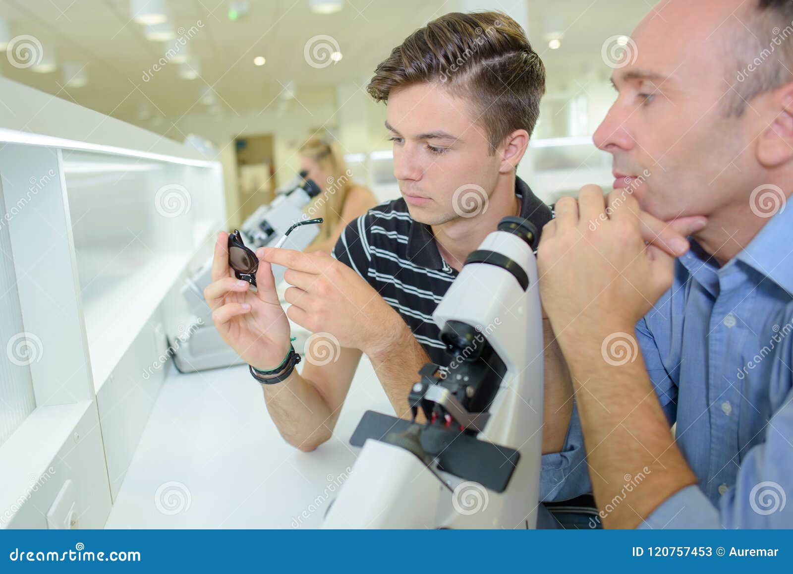 Young man looking at lens stock image. Image of teach - 120757453