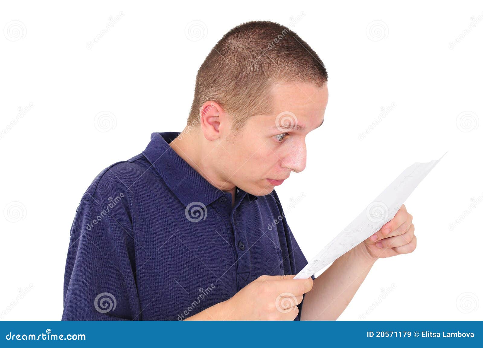 Young Man Looking at Paper with Disbelief Stock Image - Image of ...