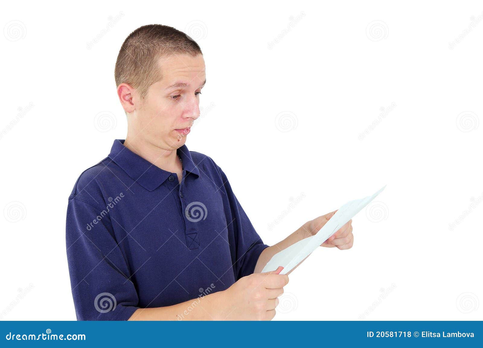Young Man Looking at Paper with Disbelief Stock Photo - Image of ...