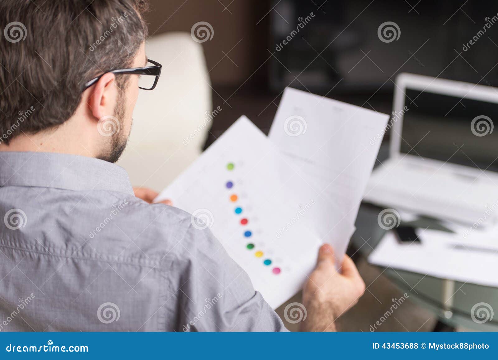 Young Man Looking at Paper in Glasses. Stock Photo - Image of indoor ...