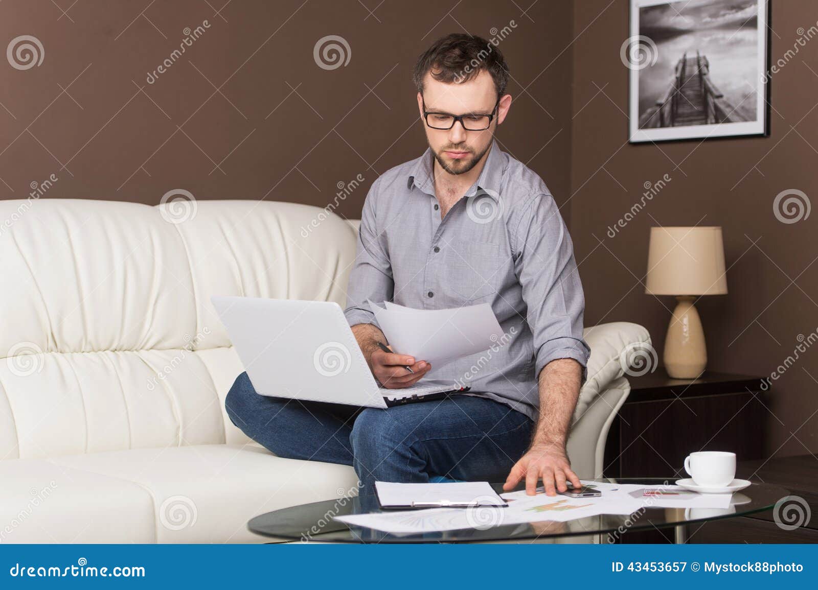 Young Man Looking at Paper in Glasses. Stock Image - Image of office ...
