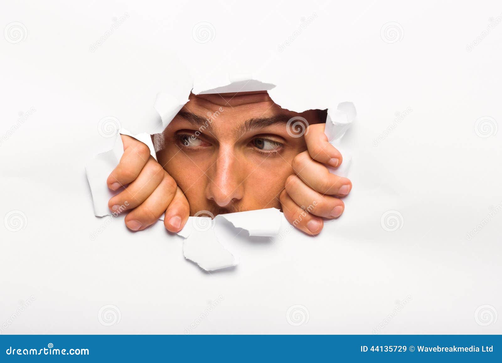 Young Man Looking through Paper Rip Stock Image - Image of view, adult ...