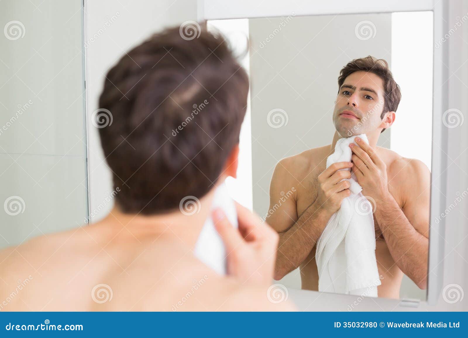 Young Man Looking at Self in Bathroom Mirror Stock Photo - Image of ... Young Man Looking at Self in Bathroom Mirror Stock Photo - Image of ...