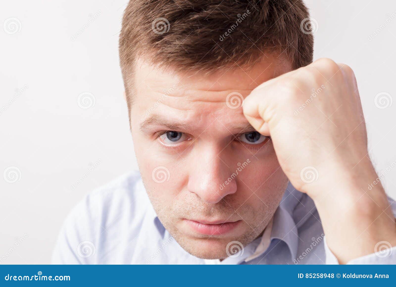 Young Man Looking Seriously Forward, Carefully Looking Stock Photo ...