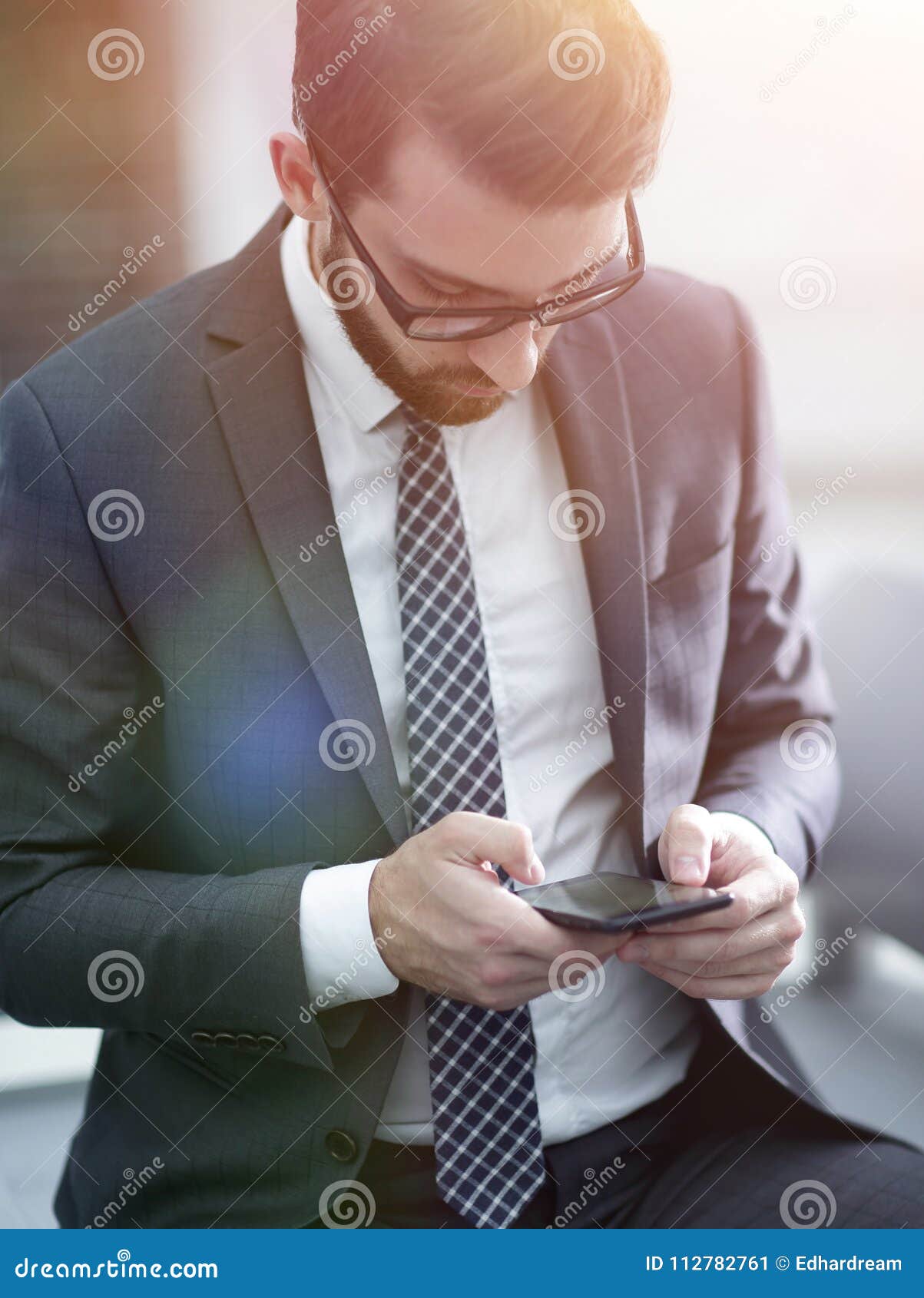 Young Man Looking at Smartphone Screen Stock Image - Image of business ...
