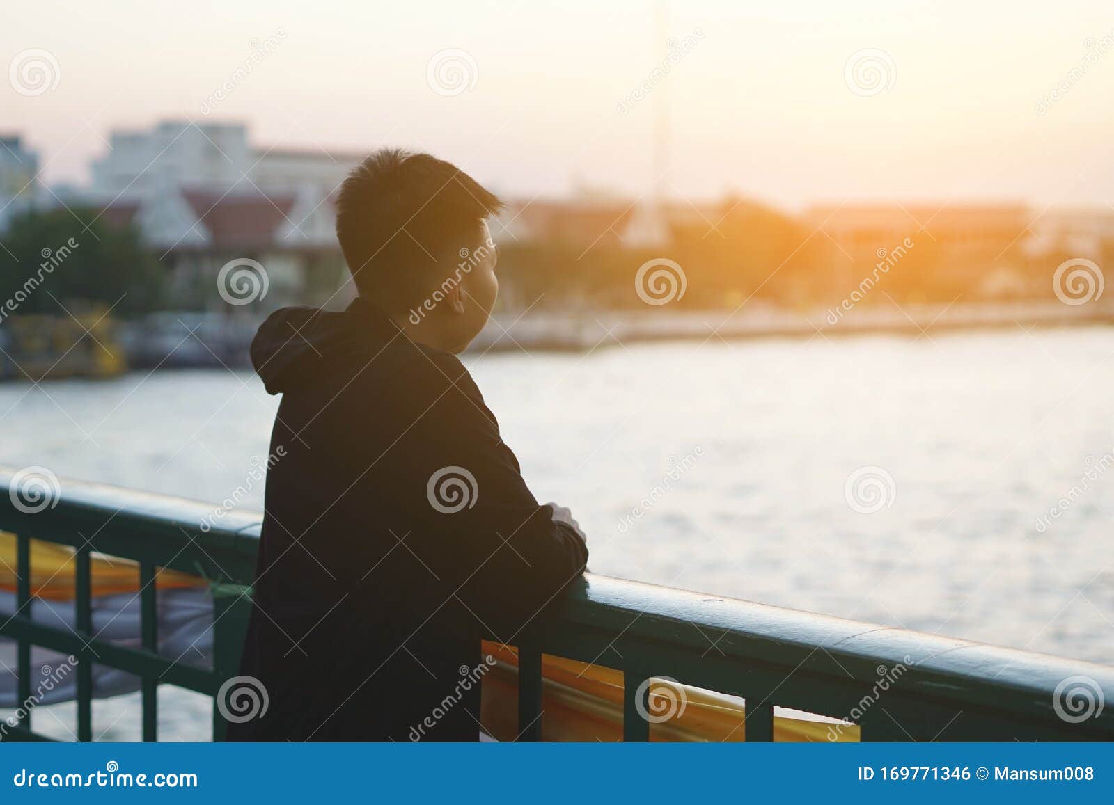 Young man looking sunset stock photo. Image of summer - 169771346