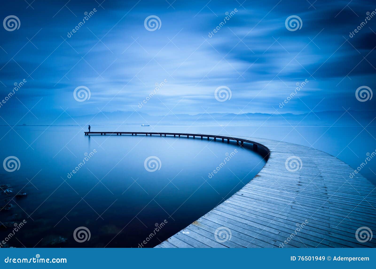 Young Man Looking To Sea on Curved Jetty Stock Image - Image of nature ...