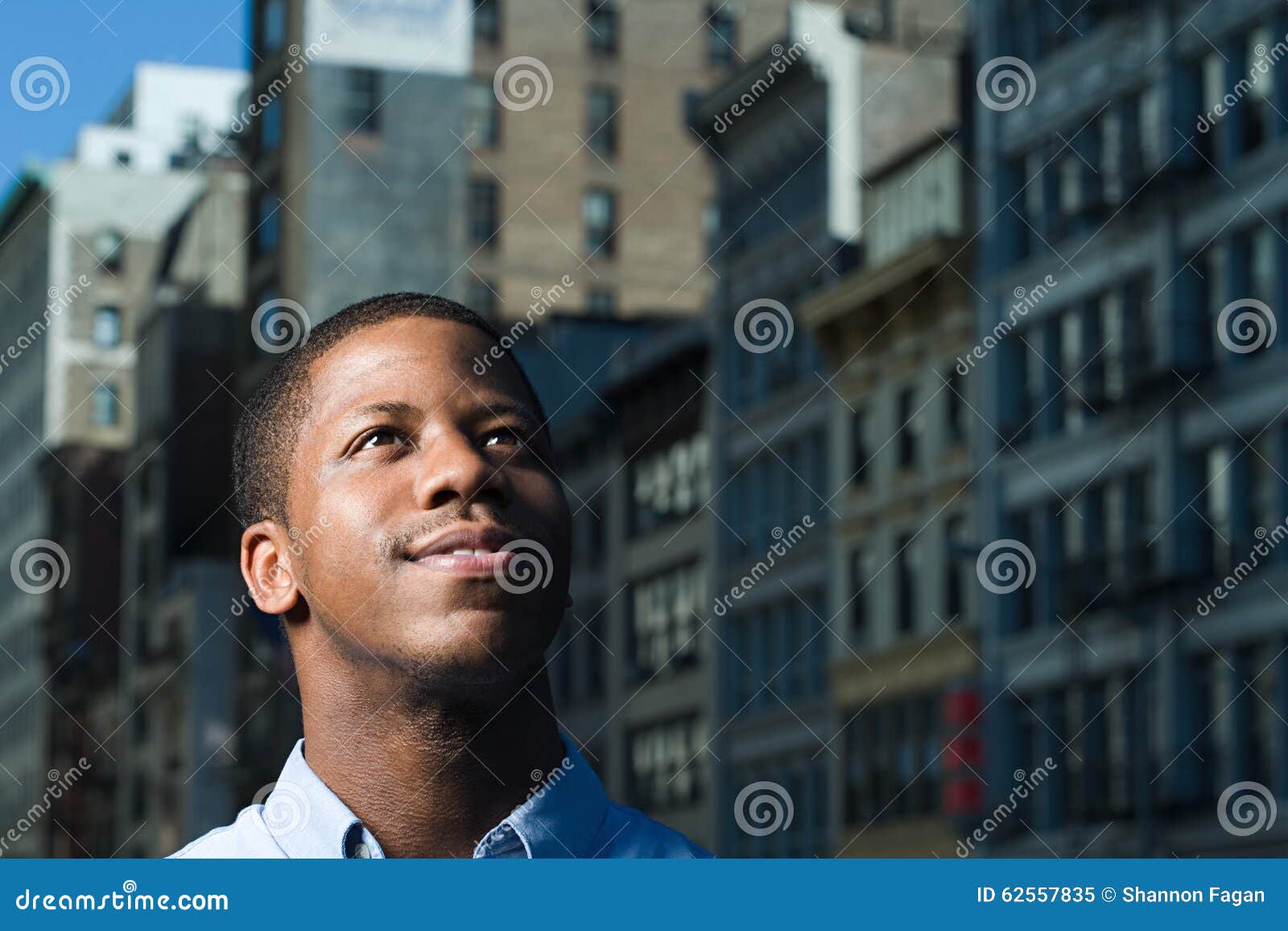 Young man looking up stock image. Image of business, looking - 62557835