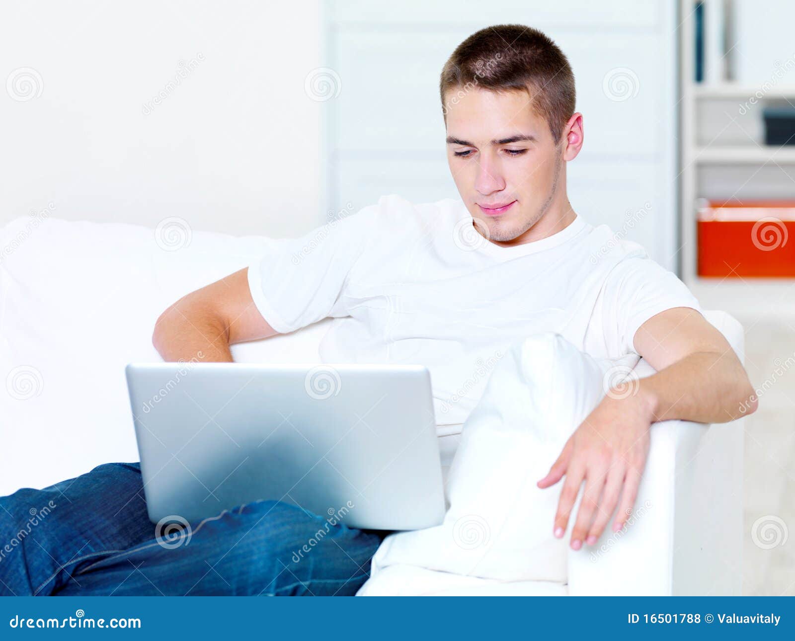 Young Man Looks in the Laptop Stock Photo - Image of typing, people ...