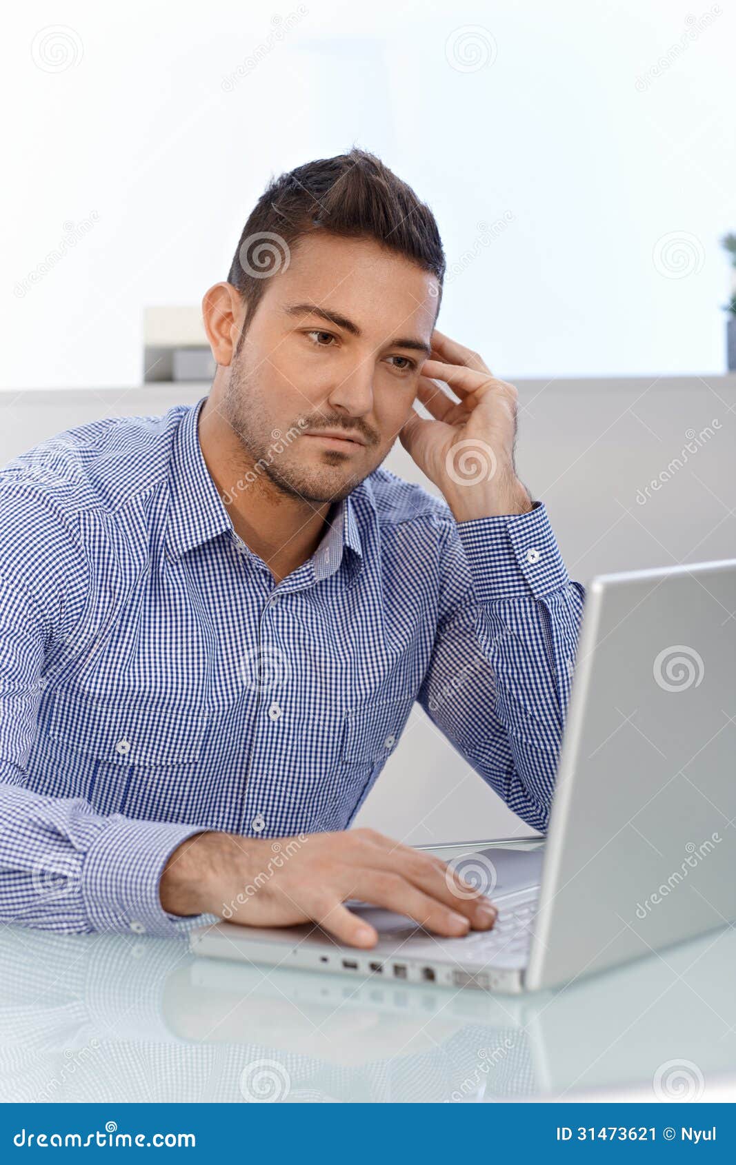 Young man lost in work stock image. Image of focusing - 31473621