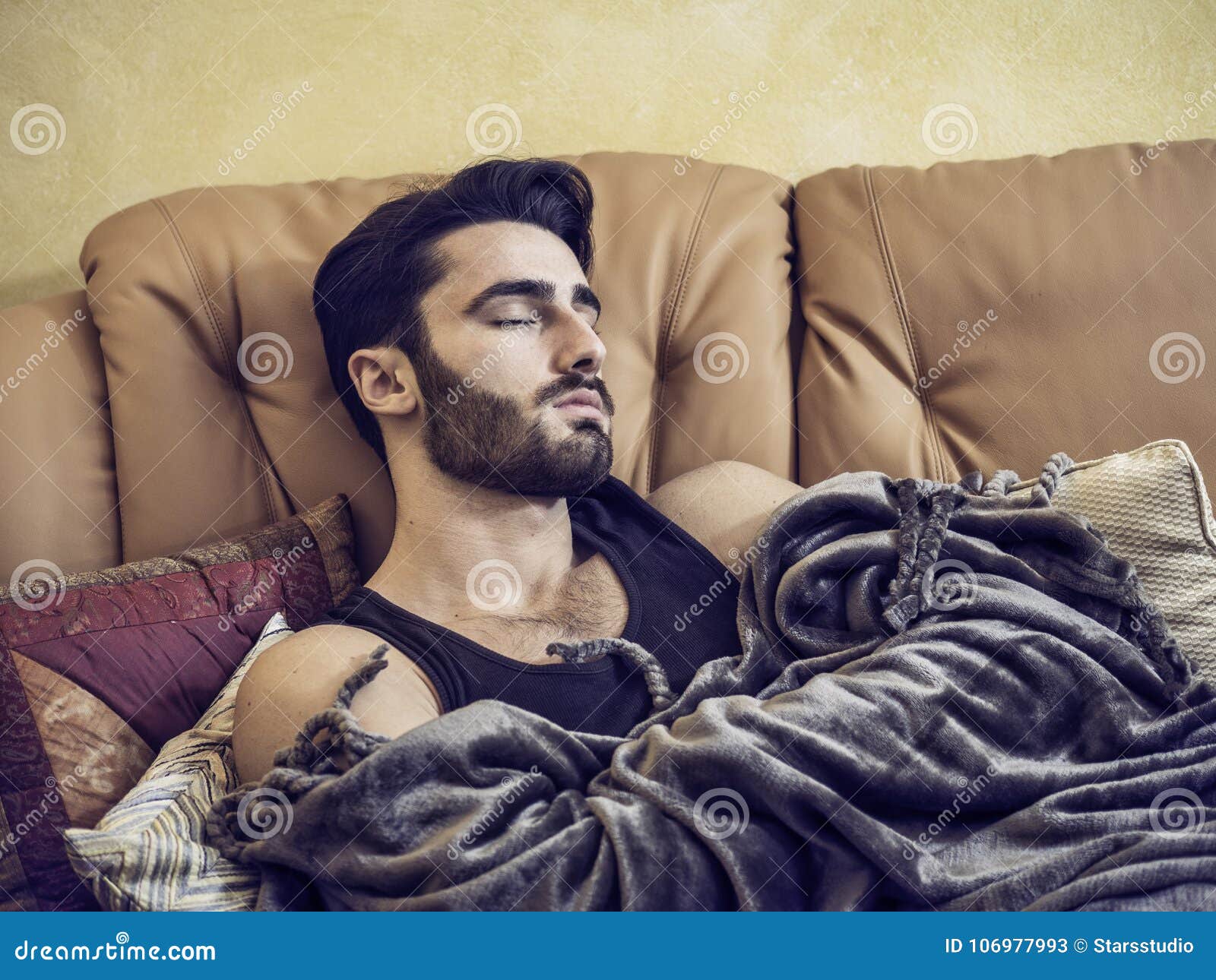 Young Man Lying Alone on a Couch, Sleeping Stock Image - Image of ...