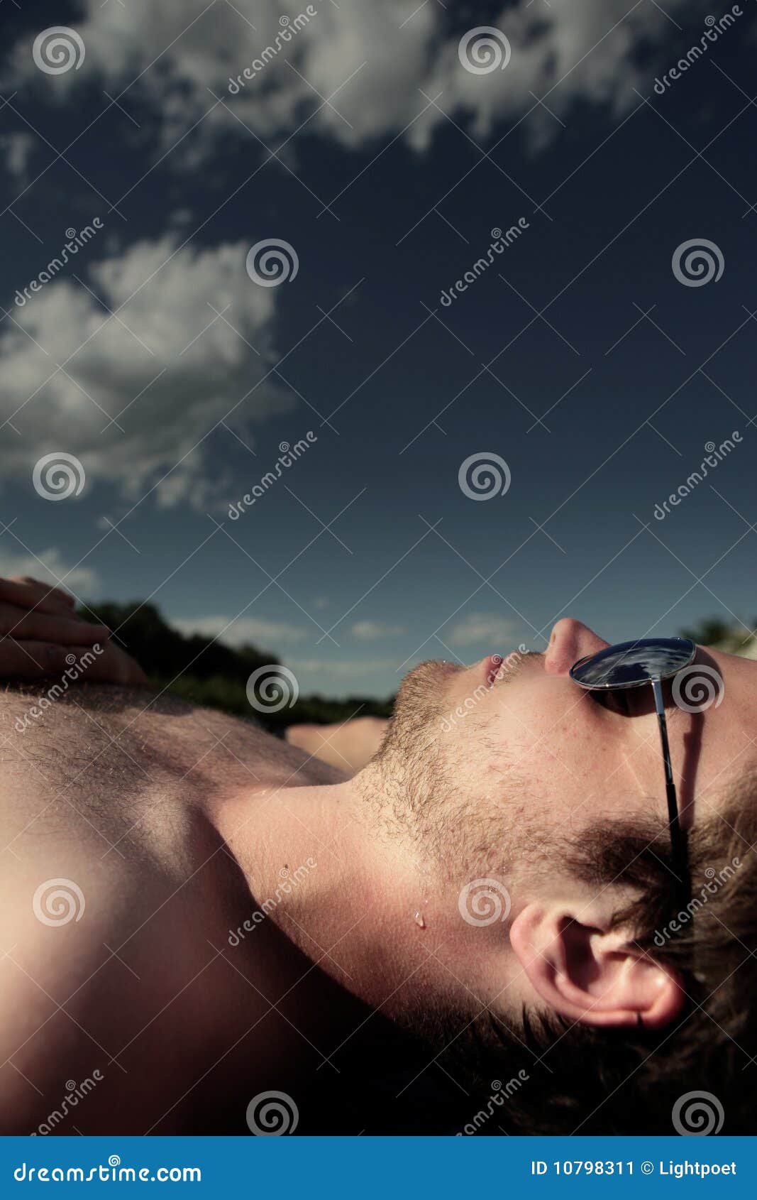 Young Man Lying on a Beach, Stock Image - Image of lying, cute: 10798311