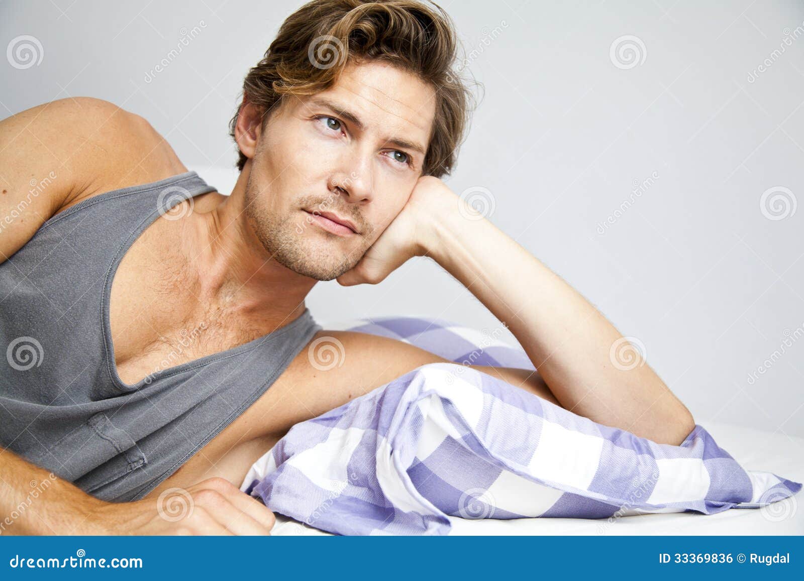 Young Man Lying in Bed Daydreaming Stock Photo - Image of hotel ...