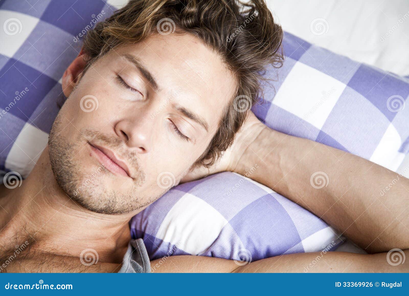 Young man lying in bed stock photo. Image of home, relaxation - 33369926