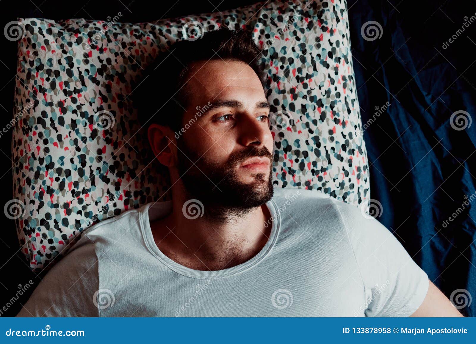 Young Man Lying in Bed Thinking Stock Photo - Image of morning, sadness ...