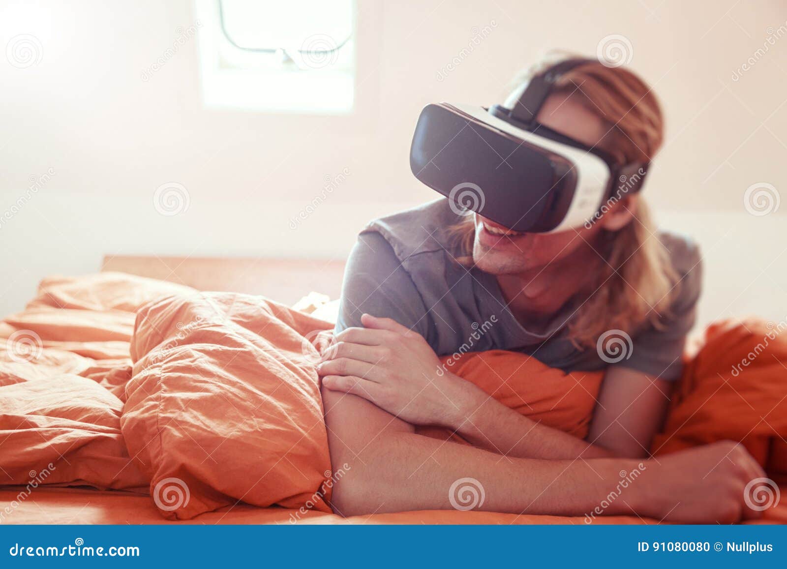 Young Man Lying on Bed with VR Glasses Stock Photo - Image of hobby ...
