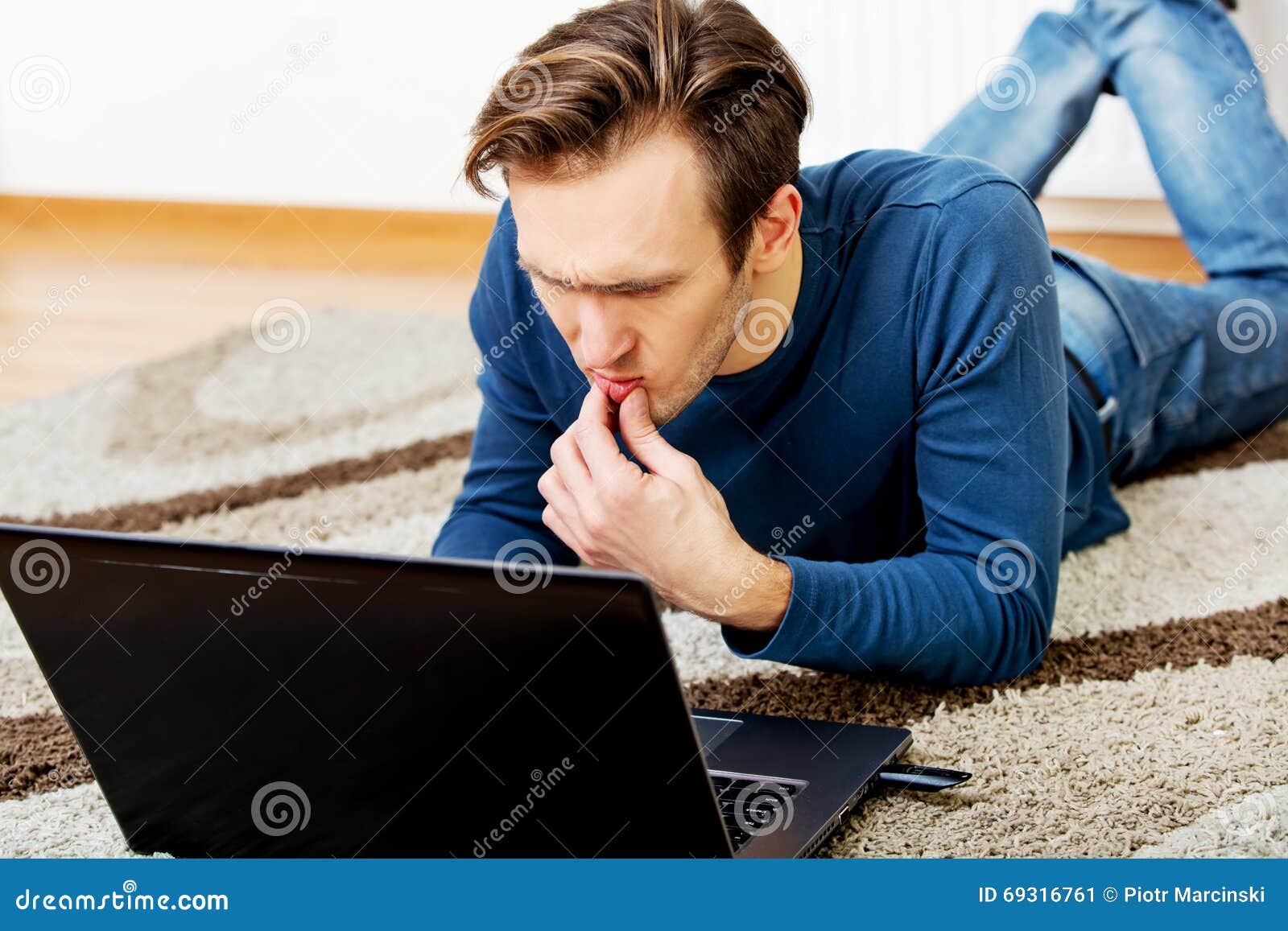 Young Man Lying on the Floor and Using Laptop Stock Image - Image of ...