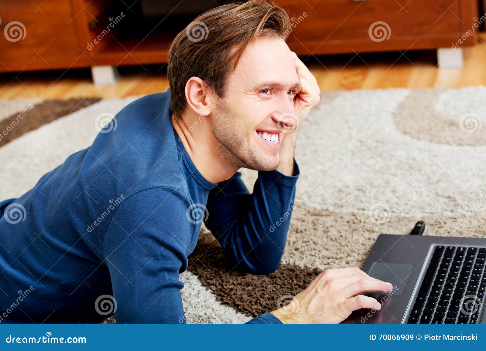 Young Man Lying on the Floor and Using Laptop Stock Image - Image of ...
