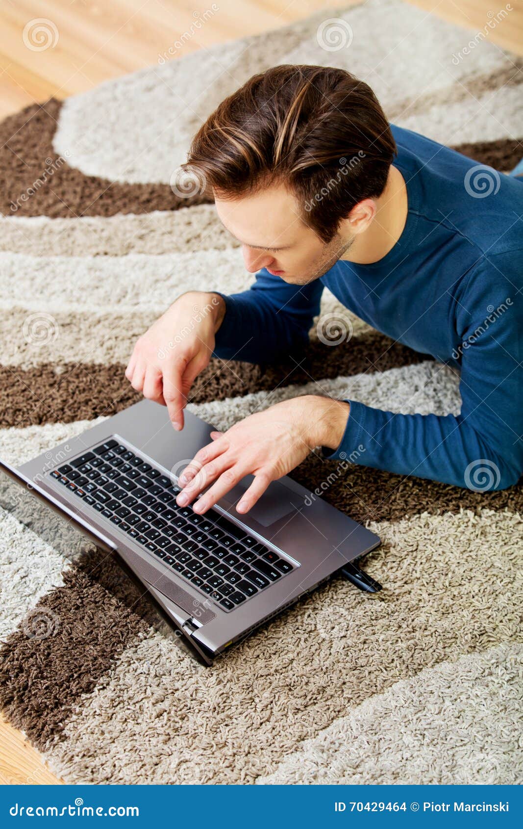 Young Man Lying on the Floor and Using Laptop Stock Photo - Image of ...