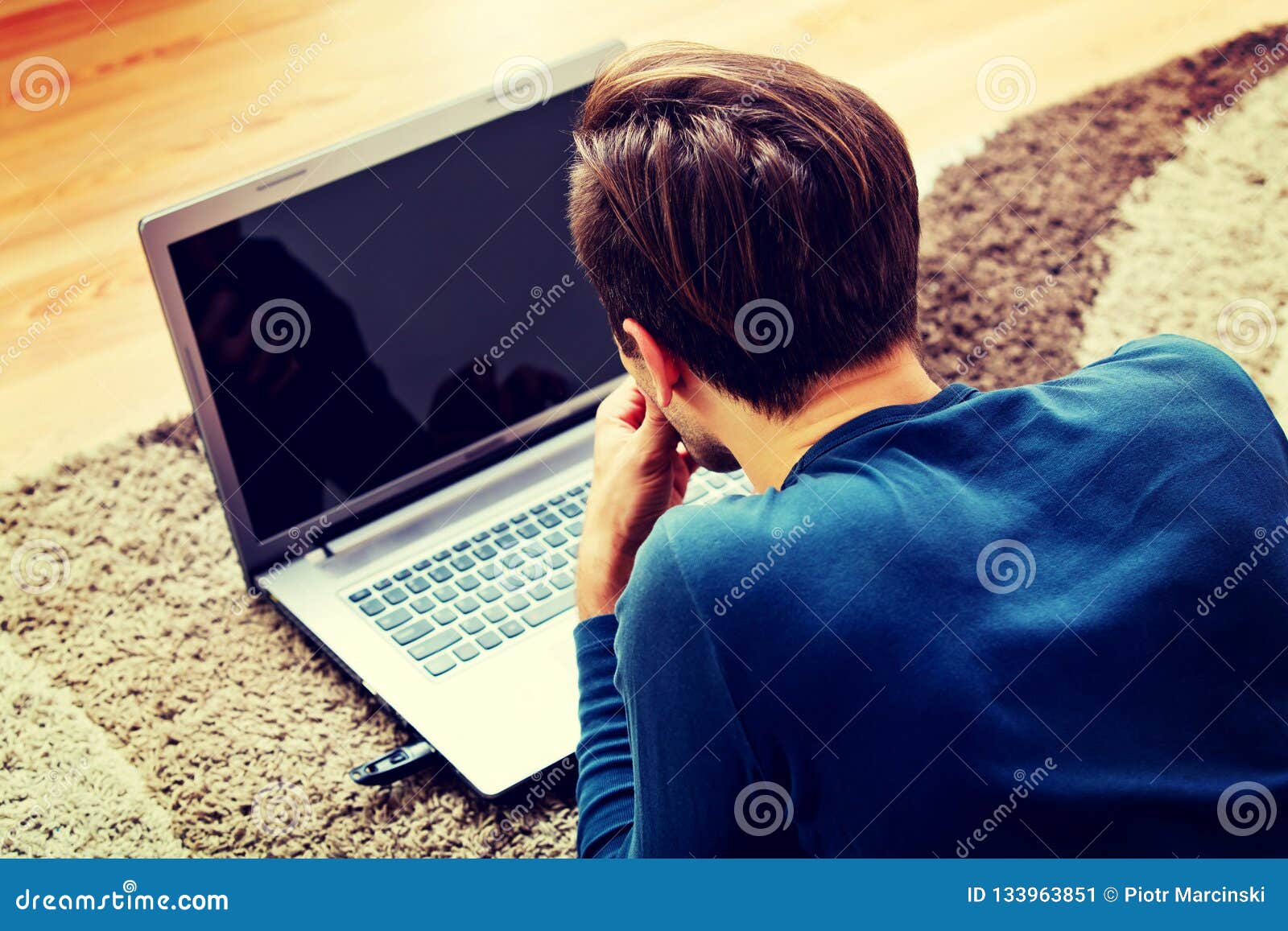 Young Man Lying on the Floor and Using Laptop Stock Image - Image of ...