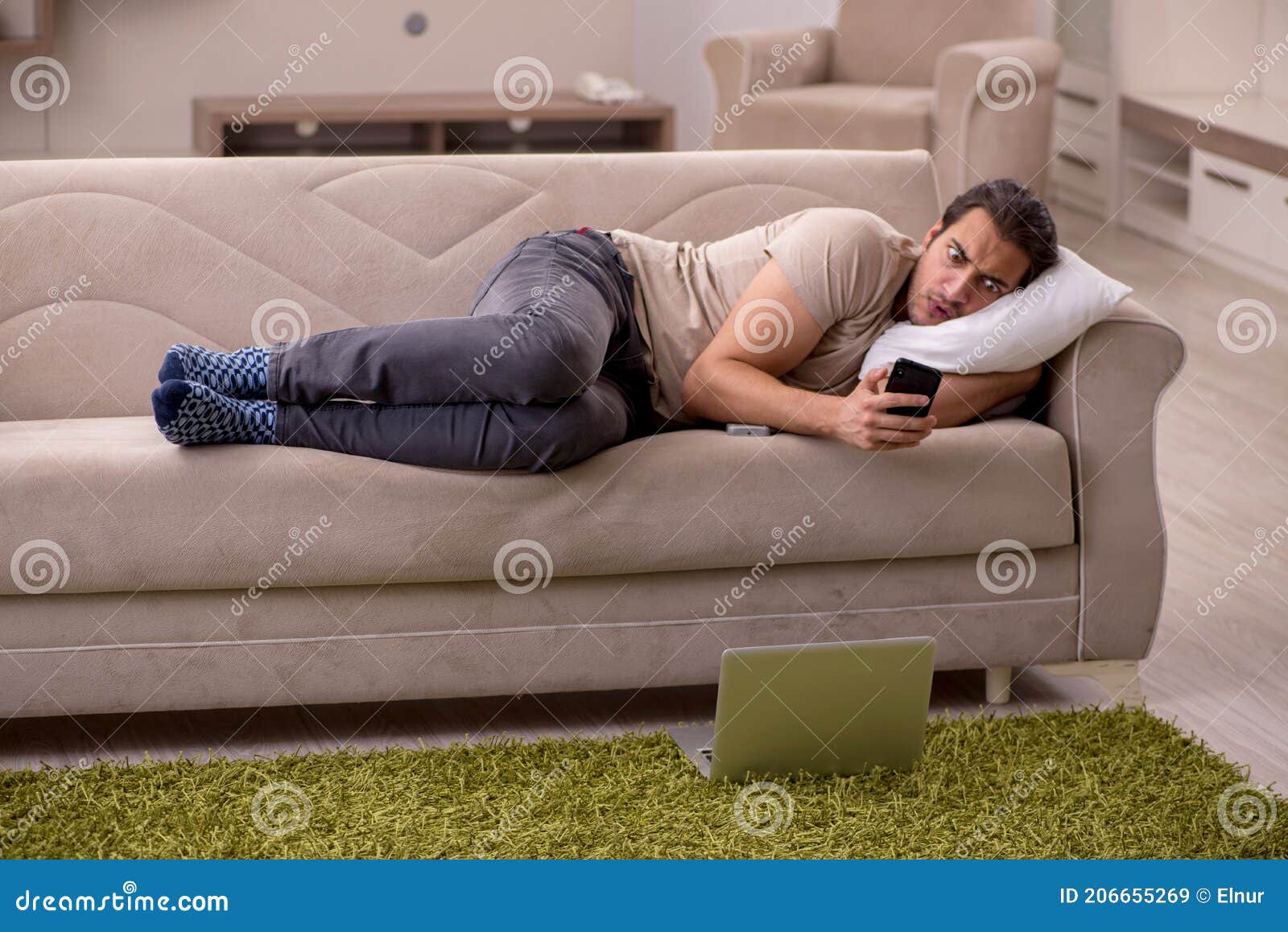 Young Man Lying on the Sofa at Home Stock Image - Image of lying ...