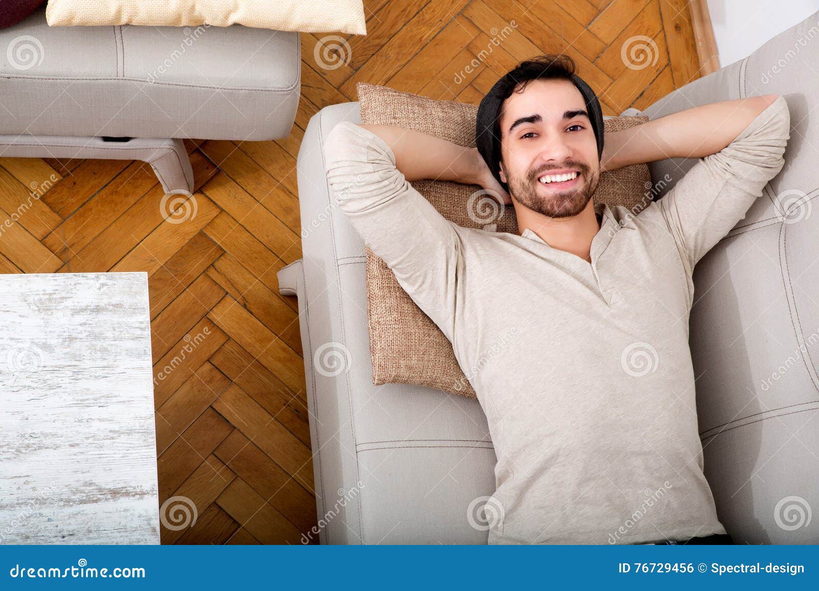 Young Man Lying on the Sofa Stock Photo - Image of relaxation, living ...