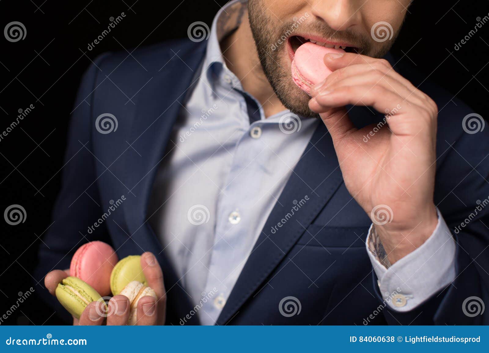 Young man with macaron stock photo. Image of young, hairstyle - 84060638