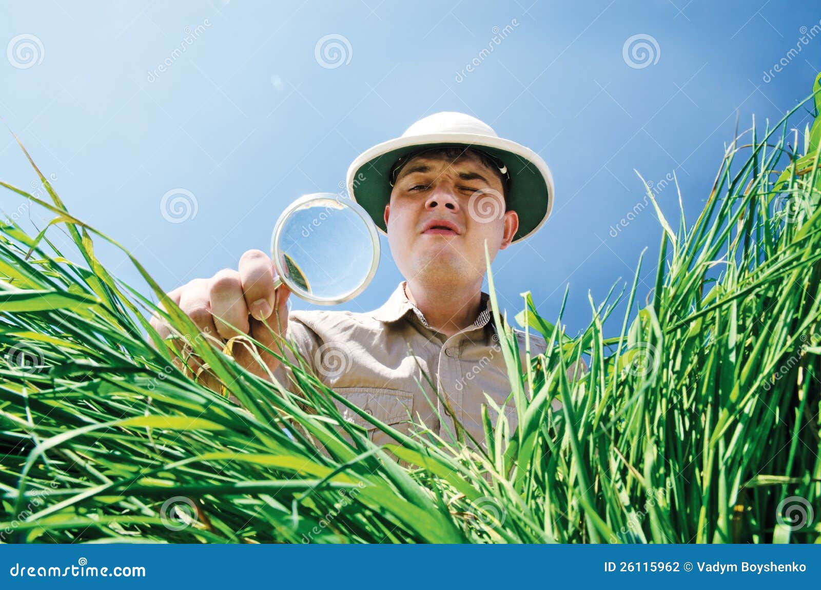 Young Man with Magnifying Glass Stock Photo - Image of science, looking ...