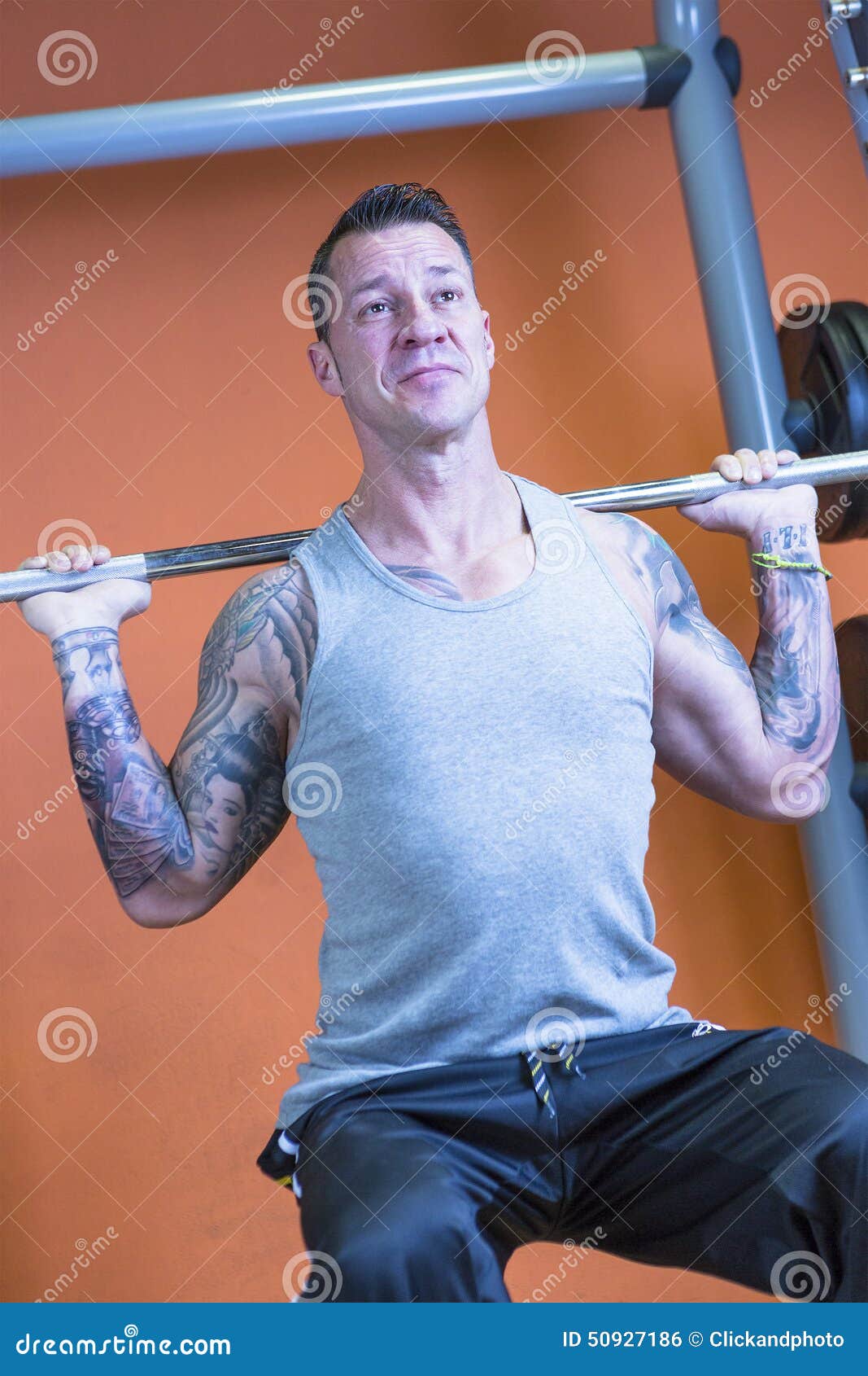 Young Man Making Barbell Squat - Workout Routine Stock Photo - Image of ...
