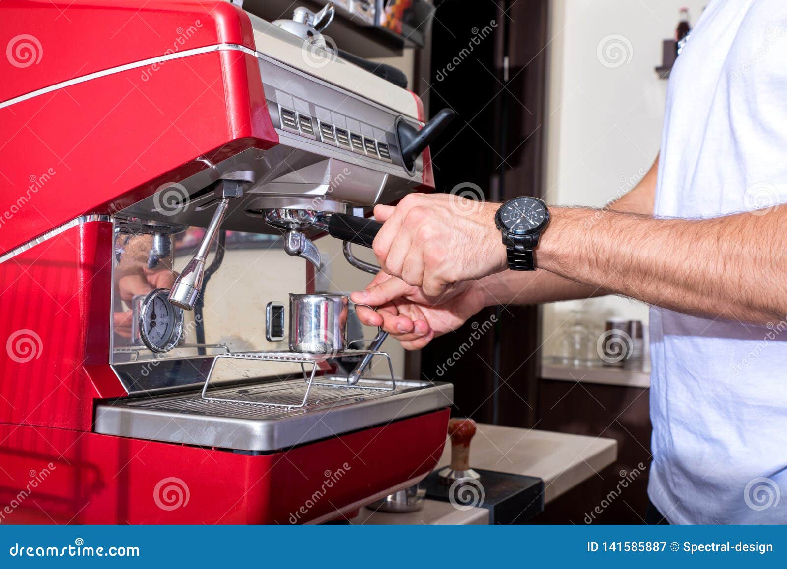 Young man making coffee stock image. Image of equipment - 141585887