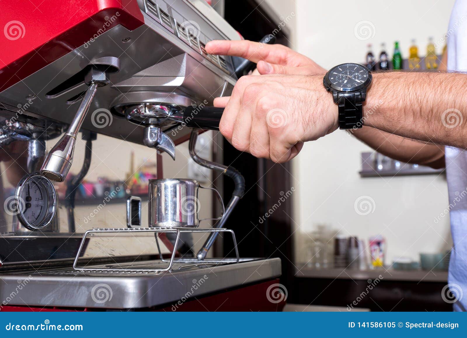 Young man making coffee stock image. Image of metallic - 141586105