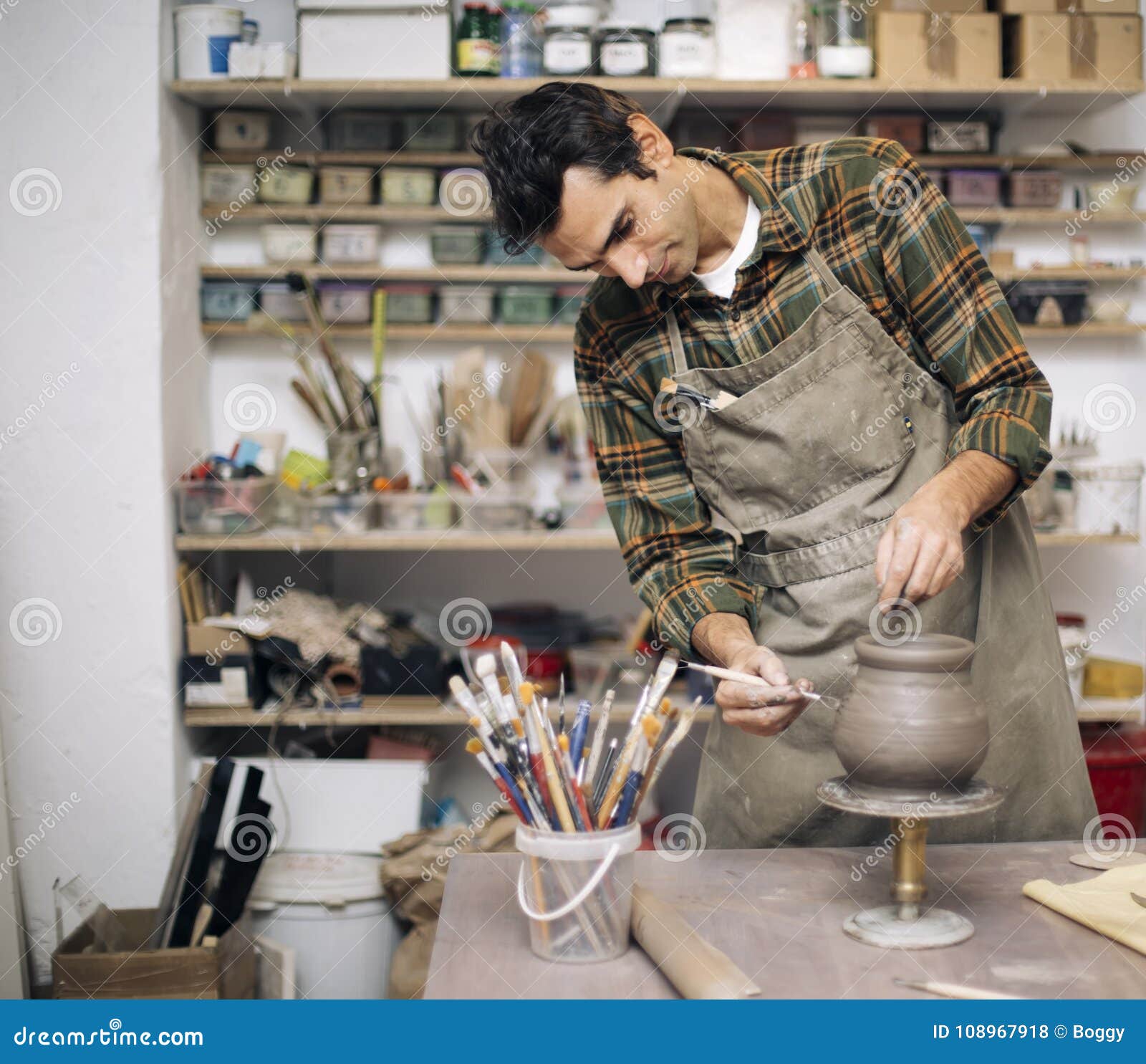 Young Man Making Pottery in Workshop Stock Photo - Image of color ...
